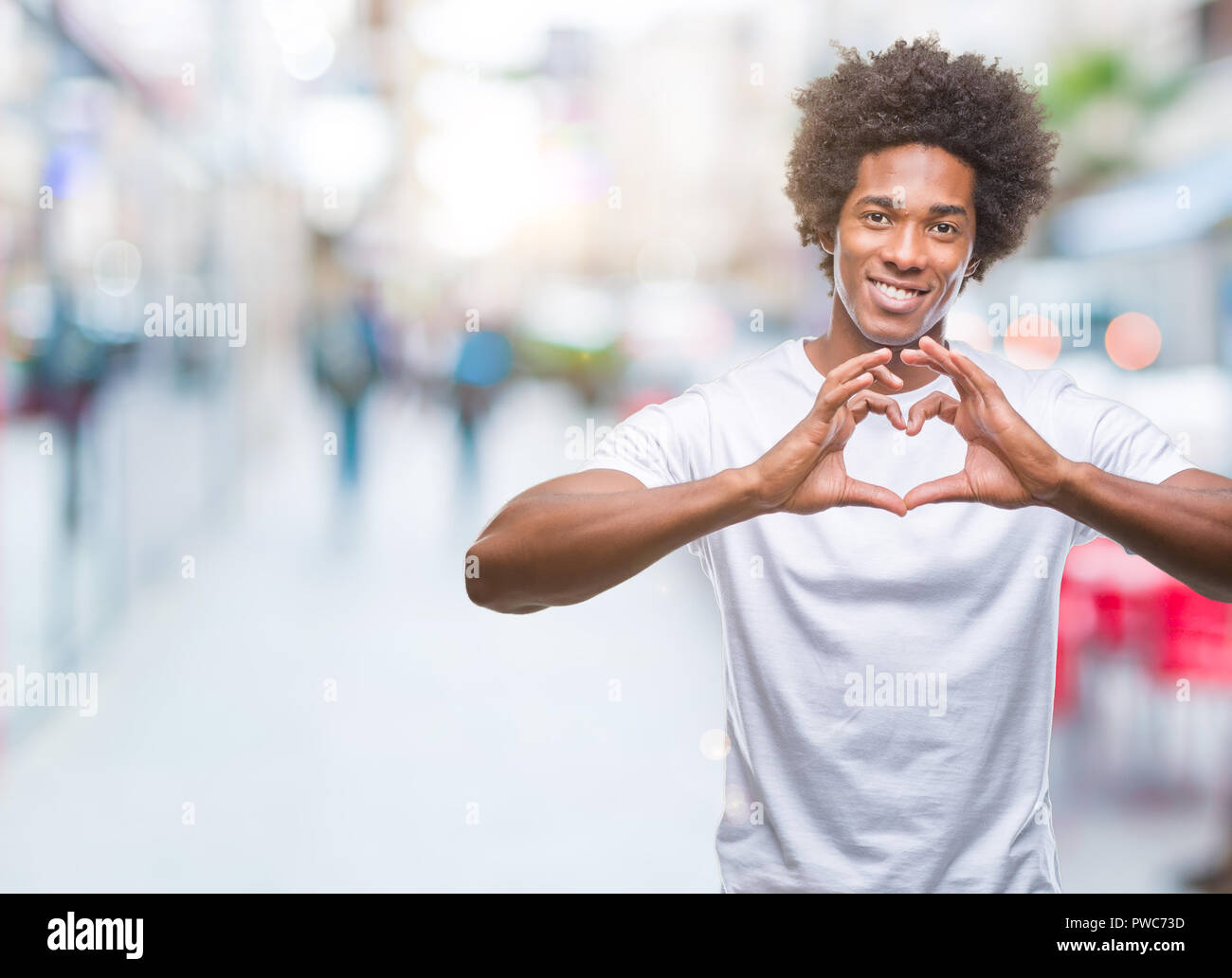 Afro american man over isolated background smiling in love showing ...