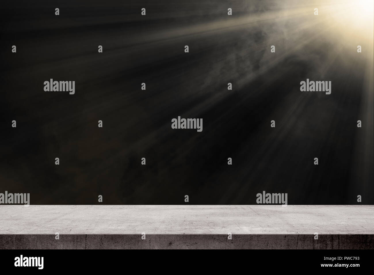 Wall with shiny light against dark background Stock Photo - Alamy