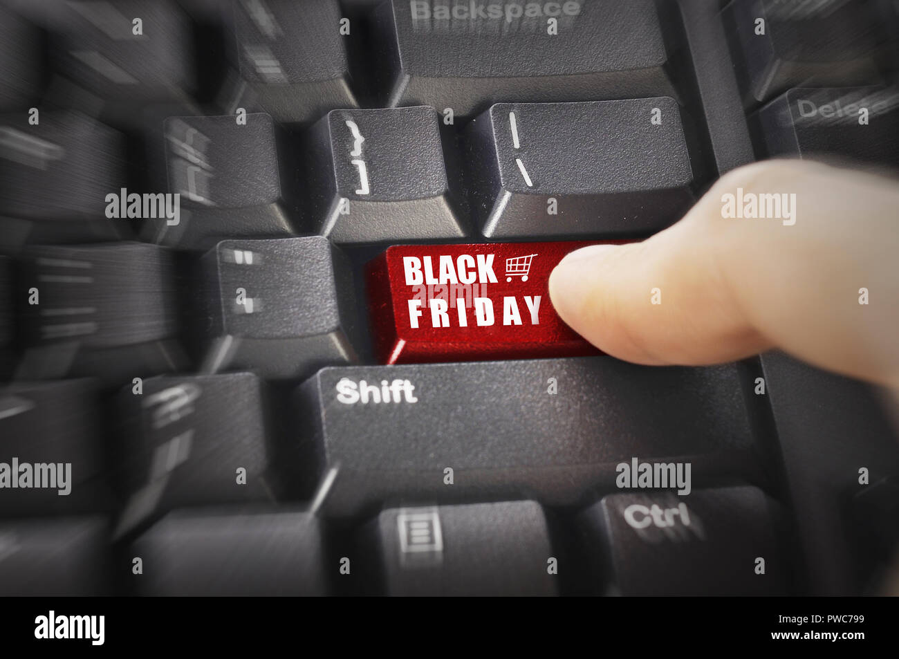 Finger push the red button with Black Friday text on keyboard Stock ...
