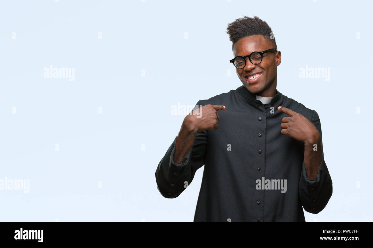 Portrait african smiling priest pointing hi-res stock photography and ...