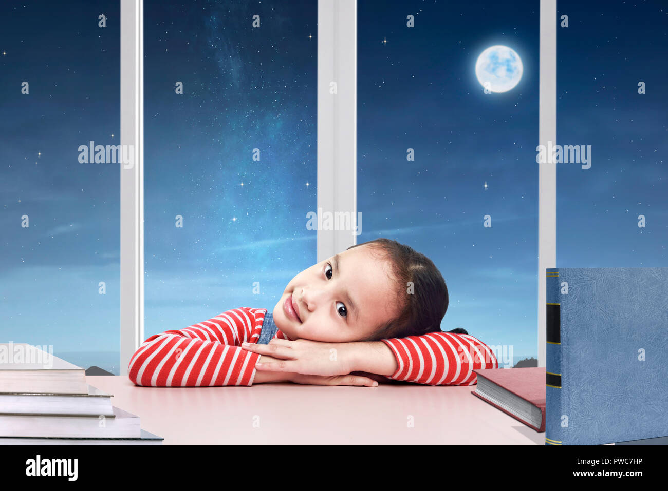 Happy asian girl relaxing after doing homework in home Stock Photo - Alamy