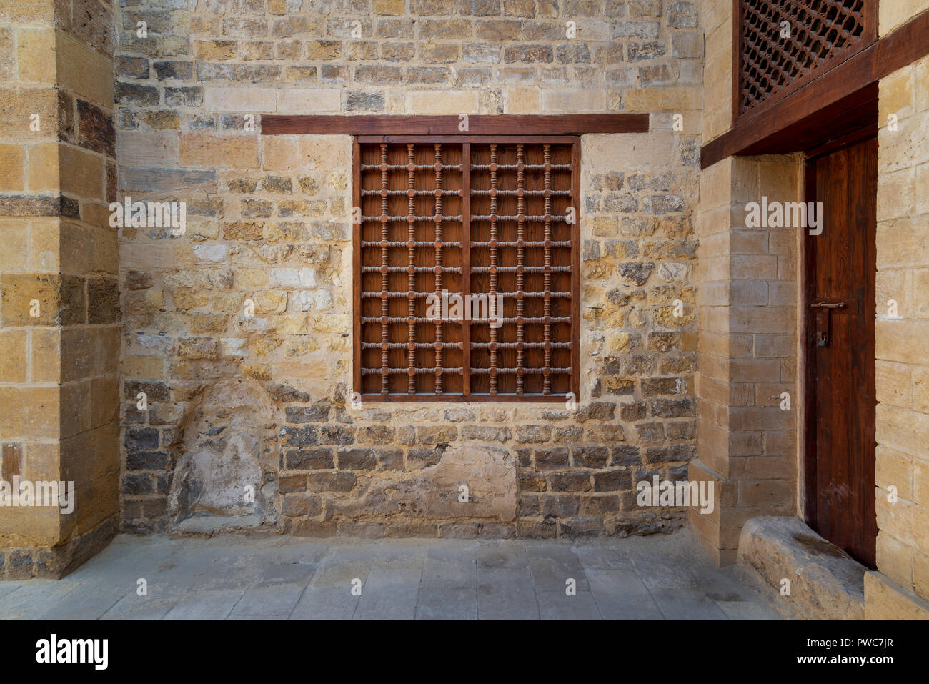 Mamluk era wooden closed window with wooden ornate grid over stone ...