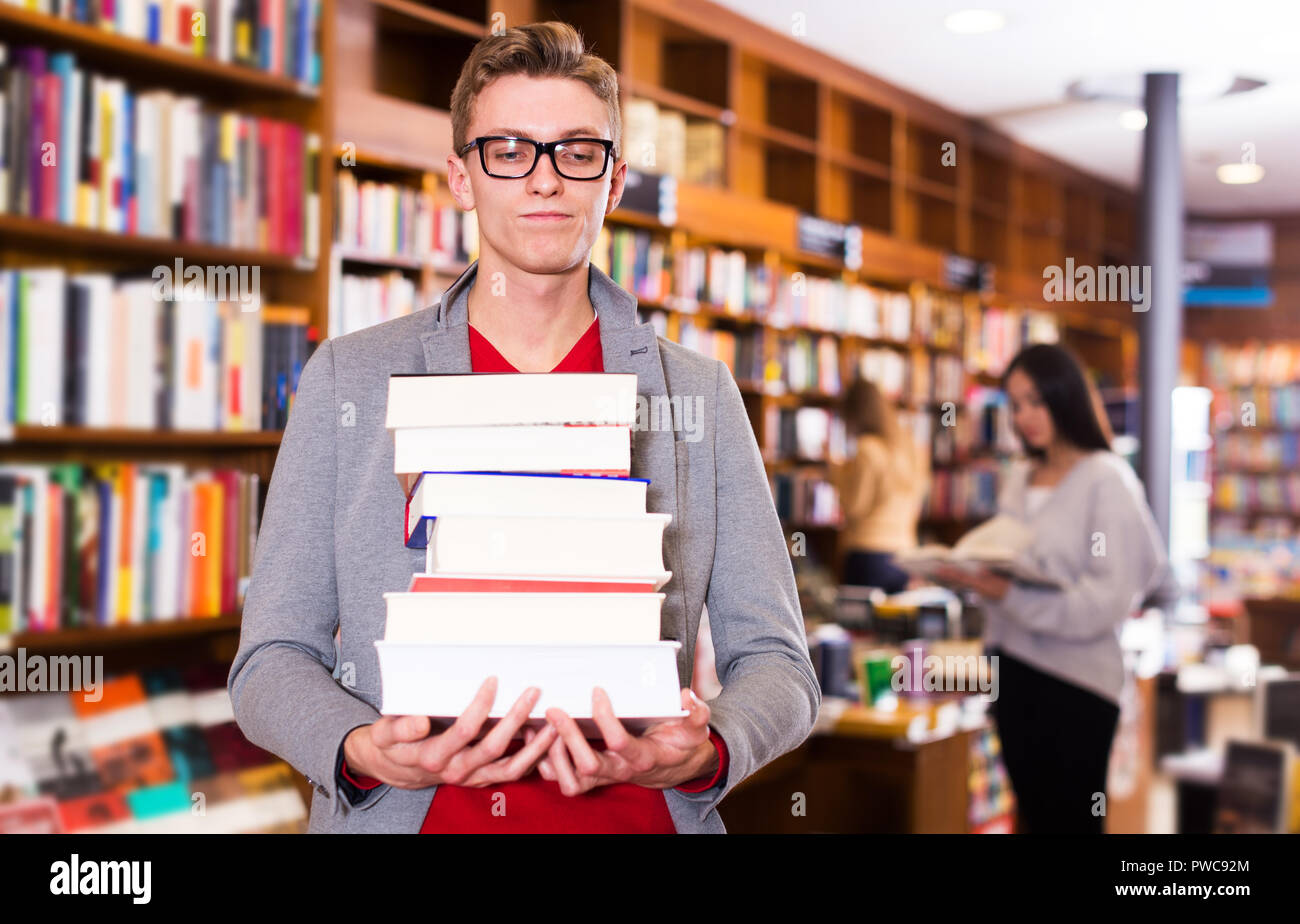 Tired man stack books hi-res stock photography and images - Alamy