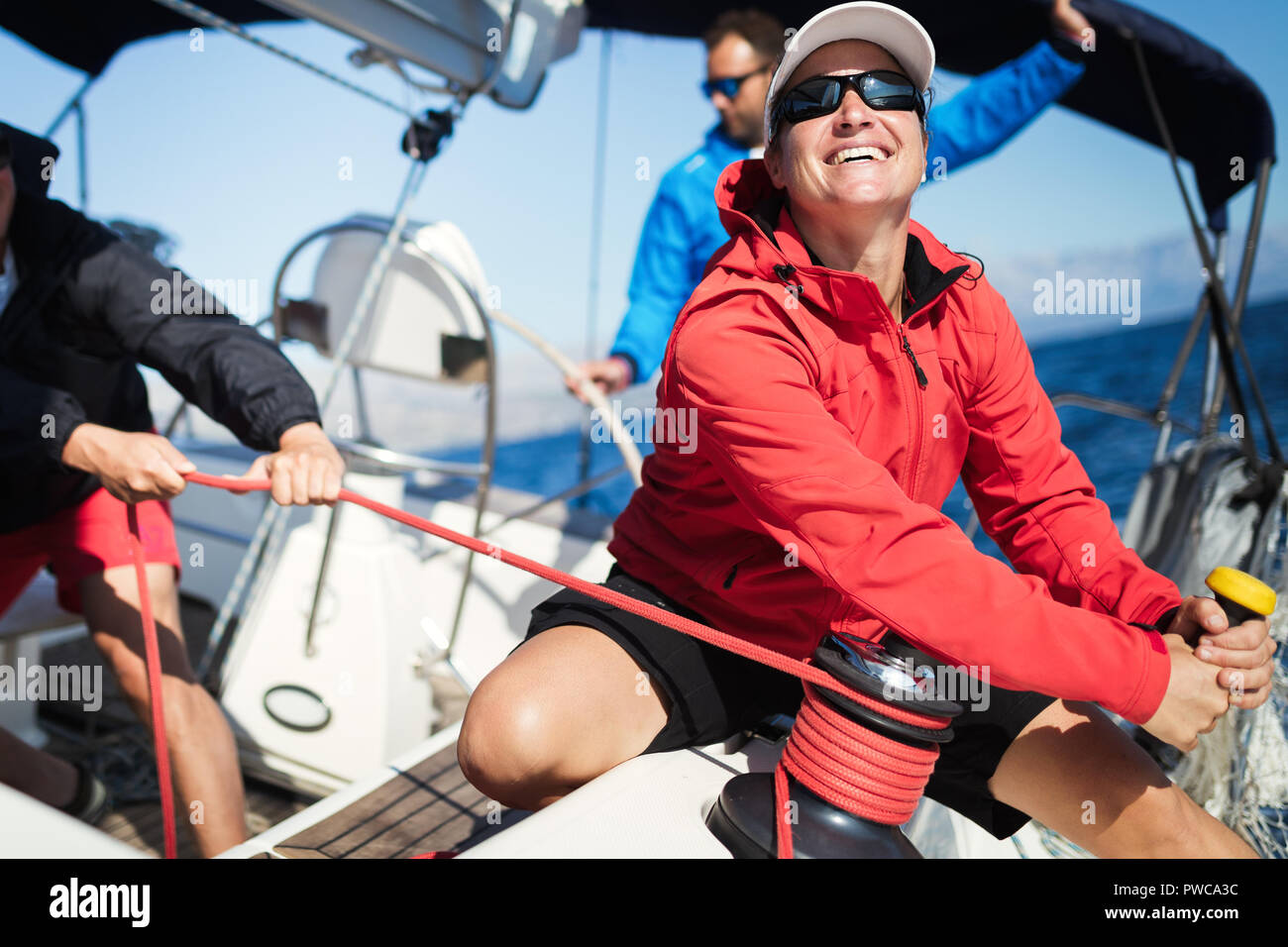 Attractive strong woman sailing with her boat Stock Photo - Alamy