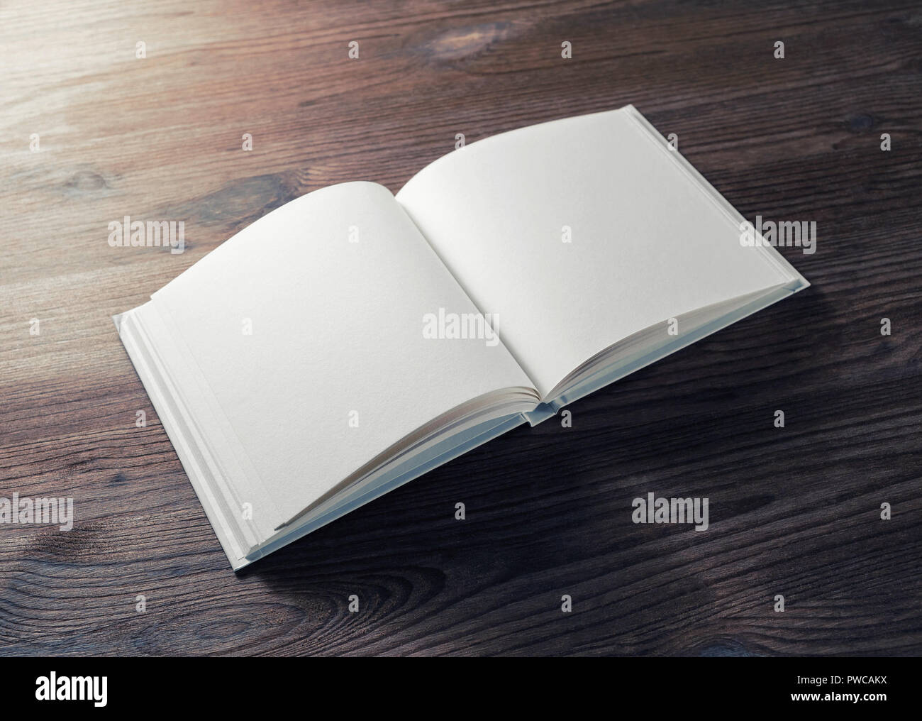 Blank opened book on wooden background. Template for design ...