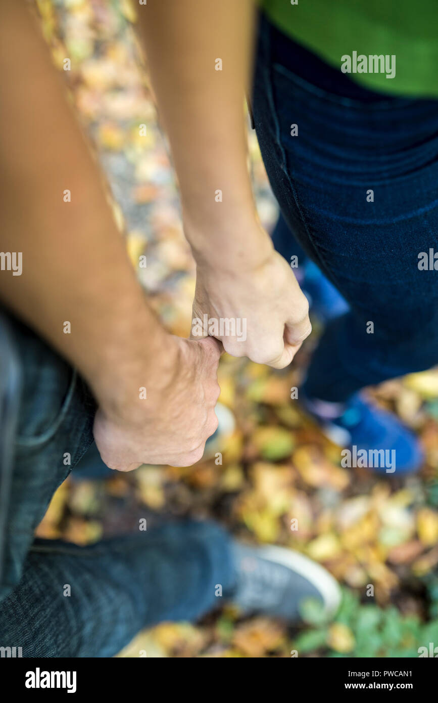 Hands linked male hi-res stock photography and images - Alamy
