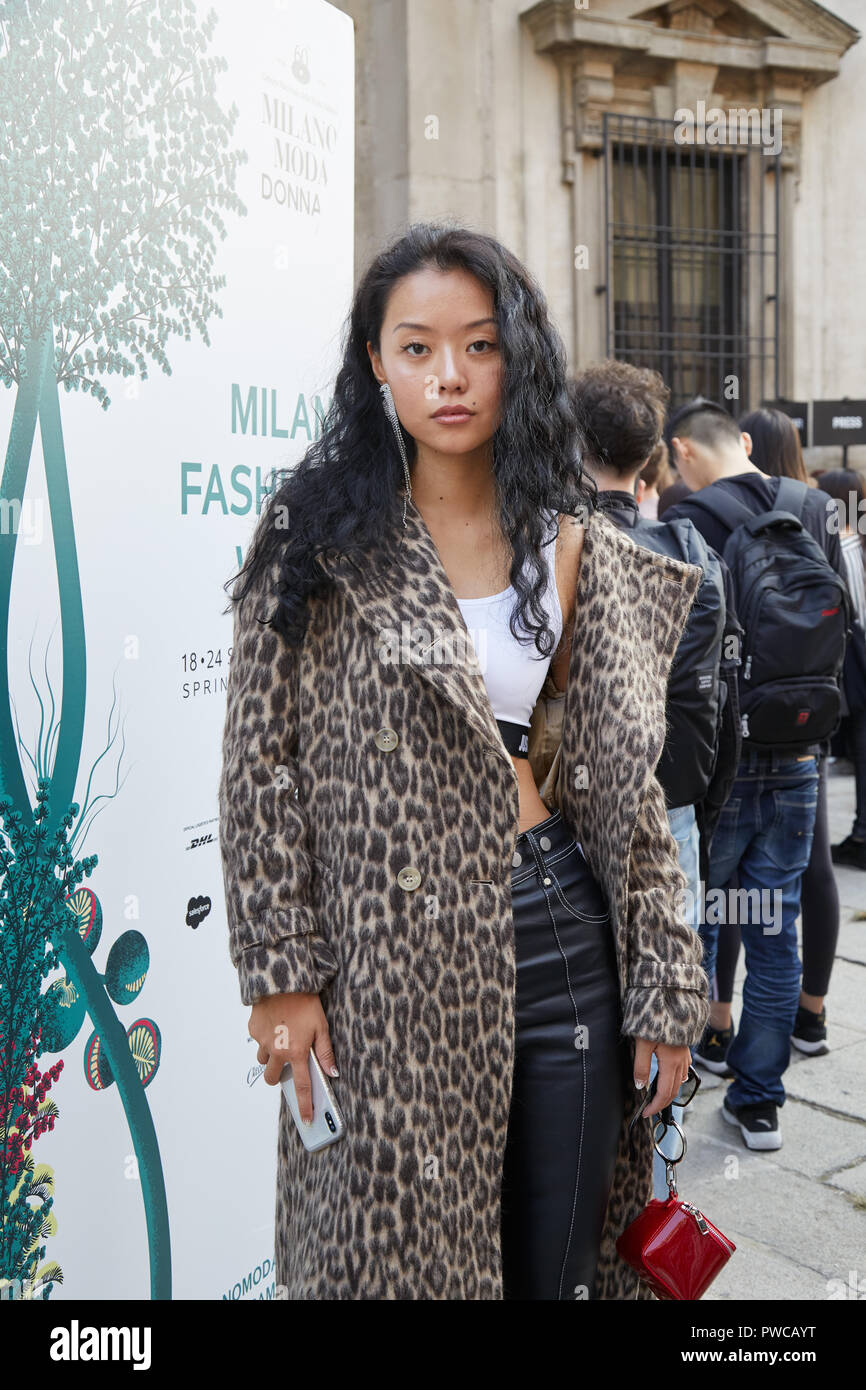 MILAN, ITALY - SEPTEMBER 20, 2018: Woman with dappled coat and denim ...