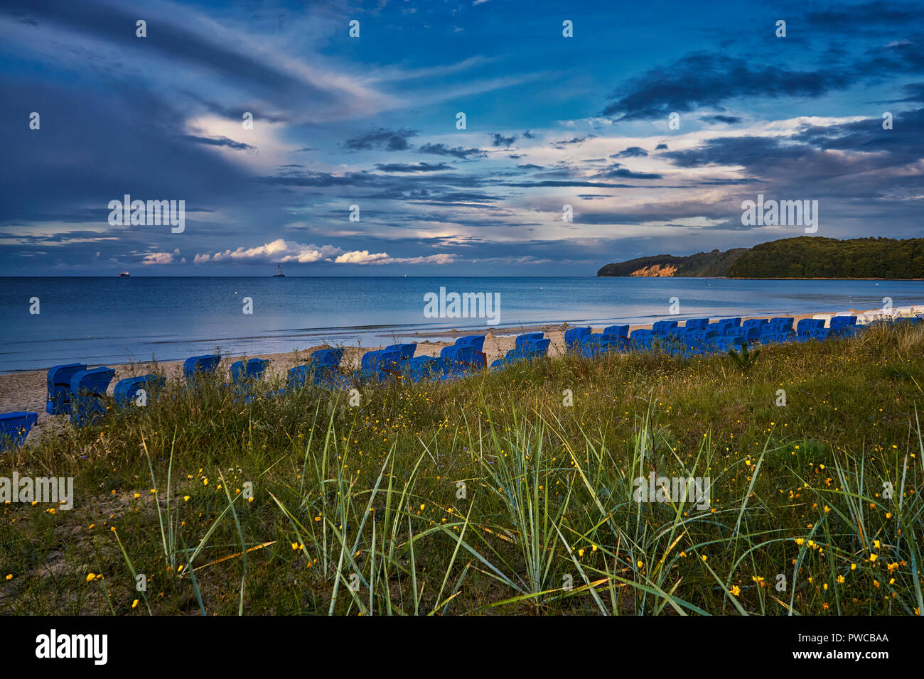 Beach and blue beach chairs on island Rugen, Northern Germany, on the ...
