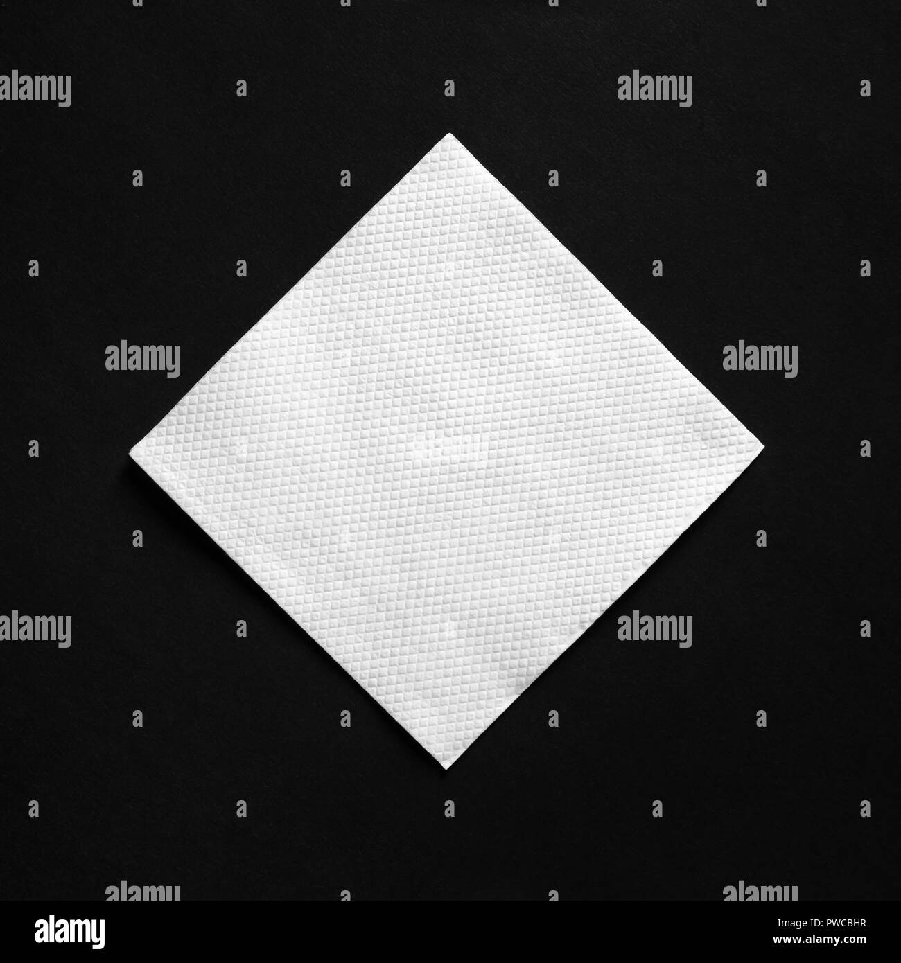 Blank white napkin on black paper background with copy space. Flat lay ...