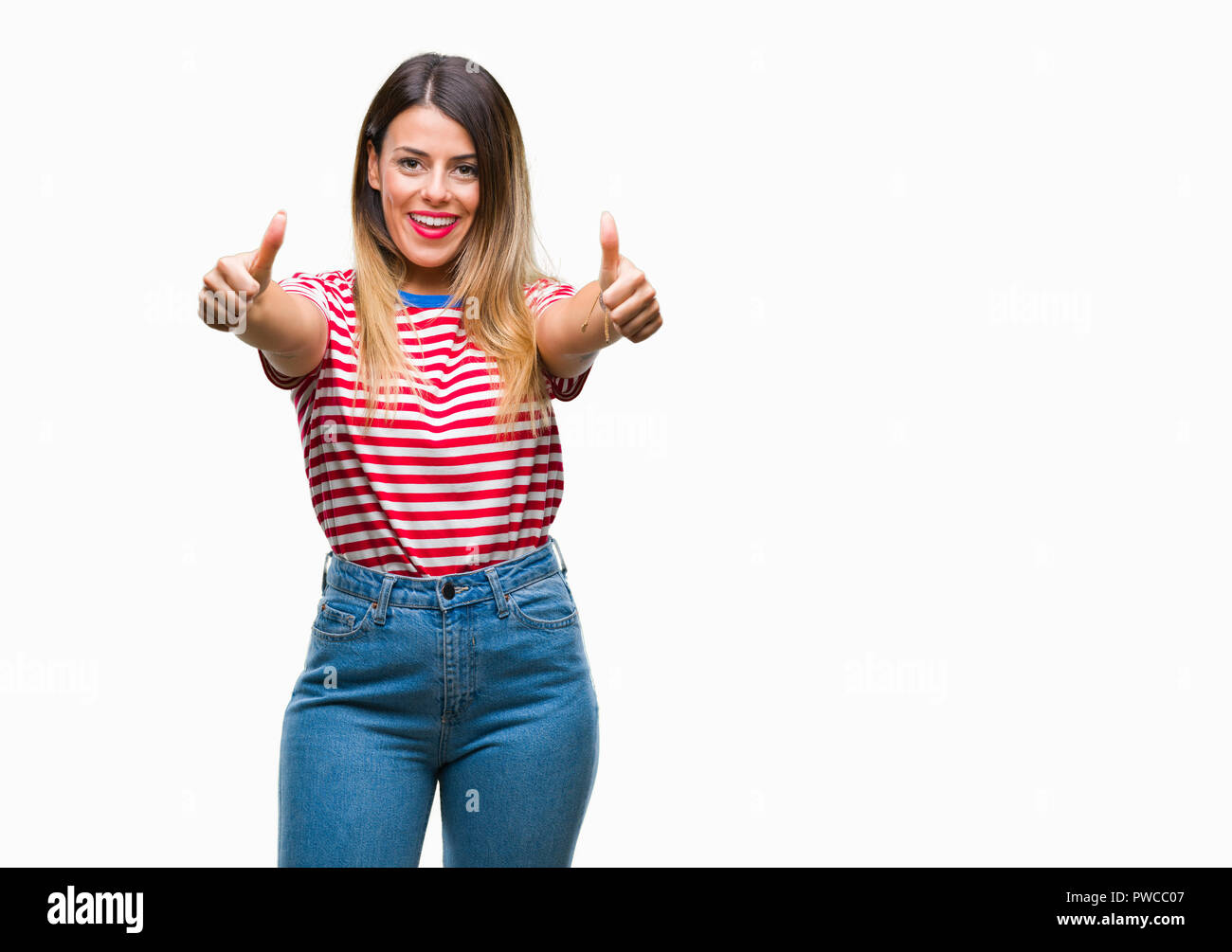 Young beautiful woman casual look over isolated background approving ...