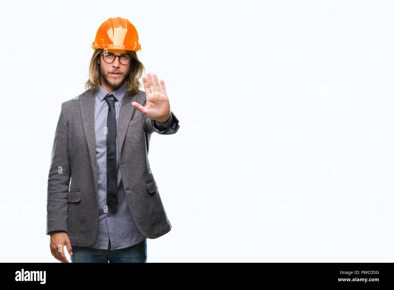 Young handsome architec man with long hair wearing safety helmet over ...
