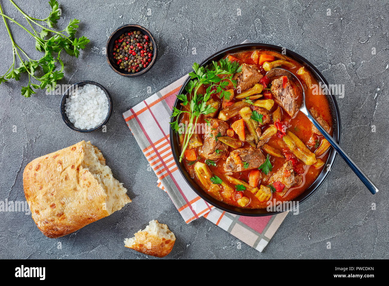 overhead view of delicious Beef and Okra Stew served in a bowl with ...