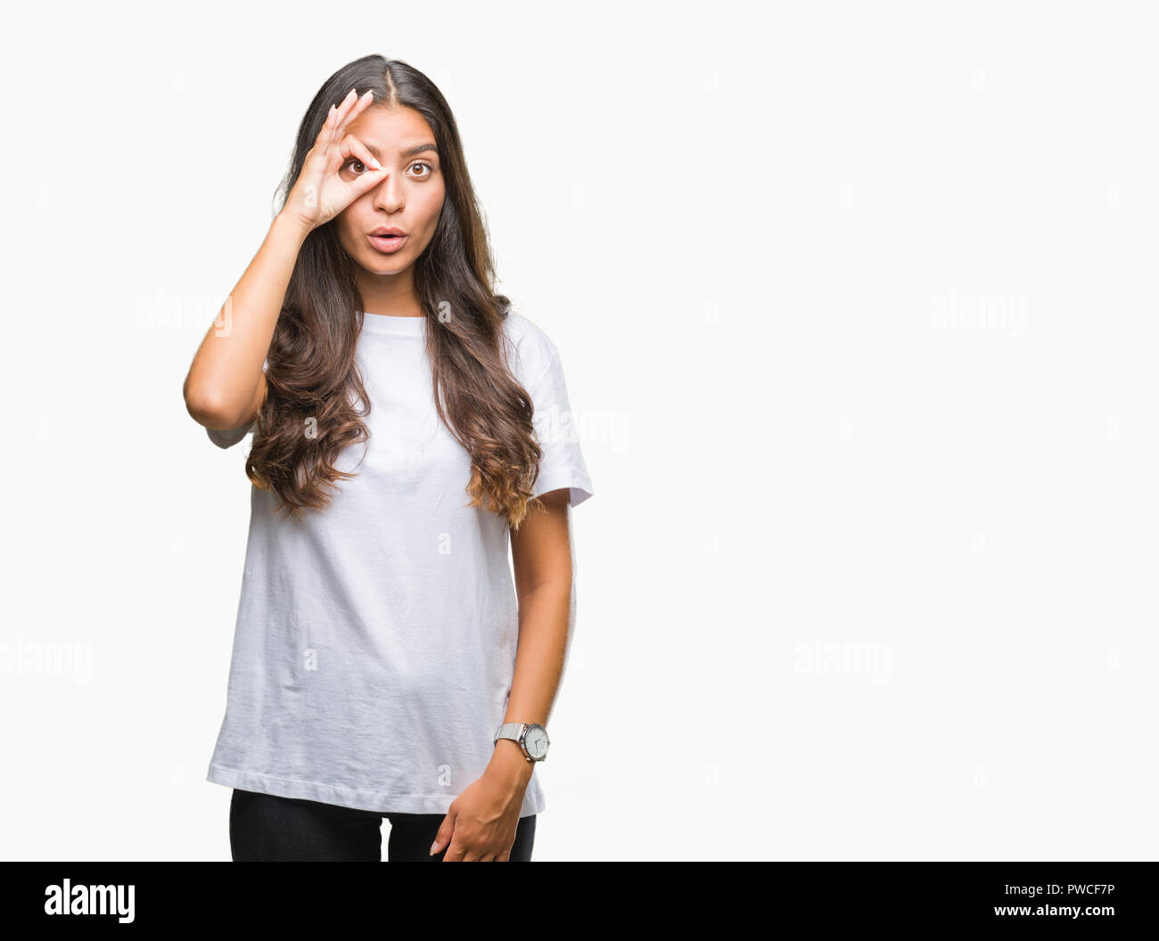 Young beautiful arab woman over isolated background doing ok gesture ...