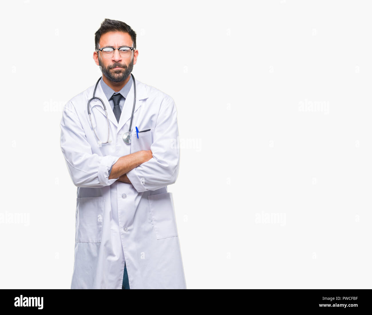 Adult hispanic doctor man over isolated background skeptic and nervous ...