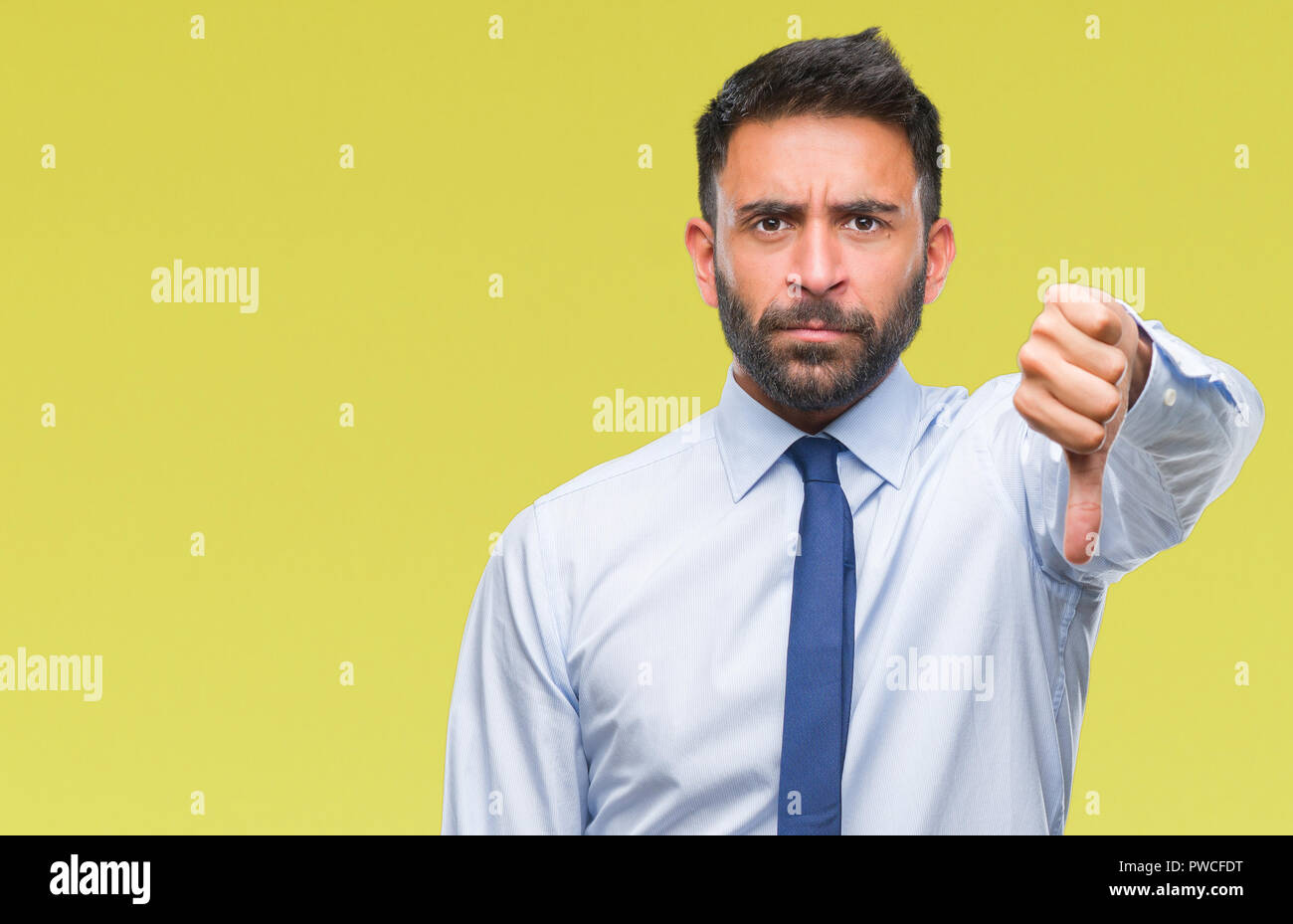 Adult hispanic business man over isolated background looking unhappy ...