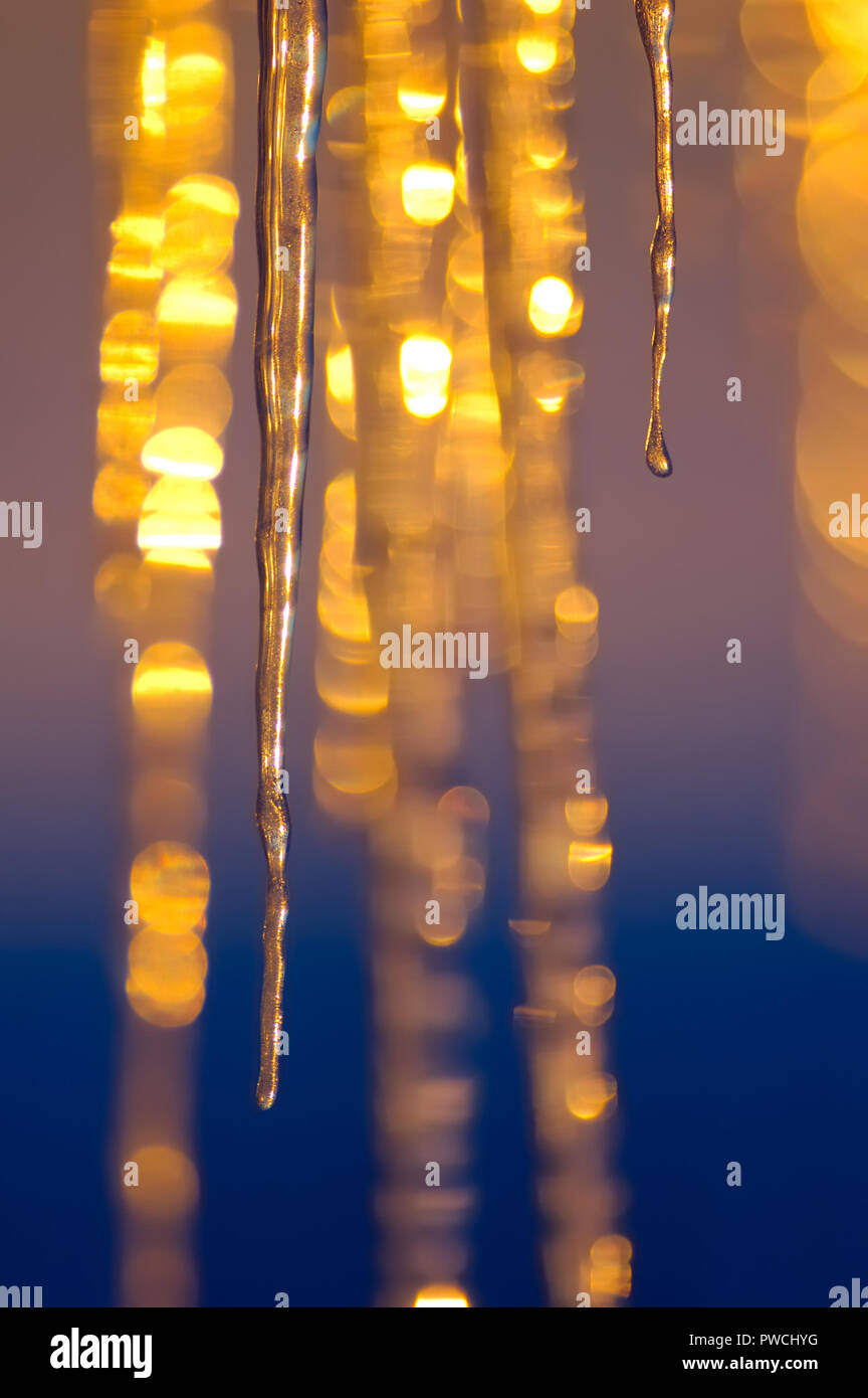 The setting arctic sun illuminates the icicles Stock Photo - Alamy