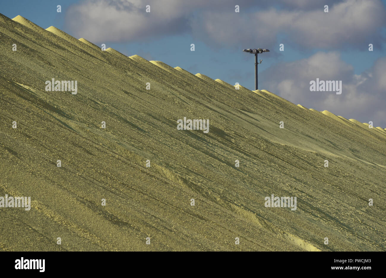 Sulfur piles storage at the PAO Gazprom factory in Astrakhan, Russia ...