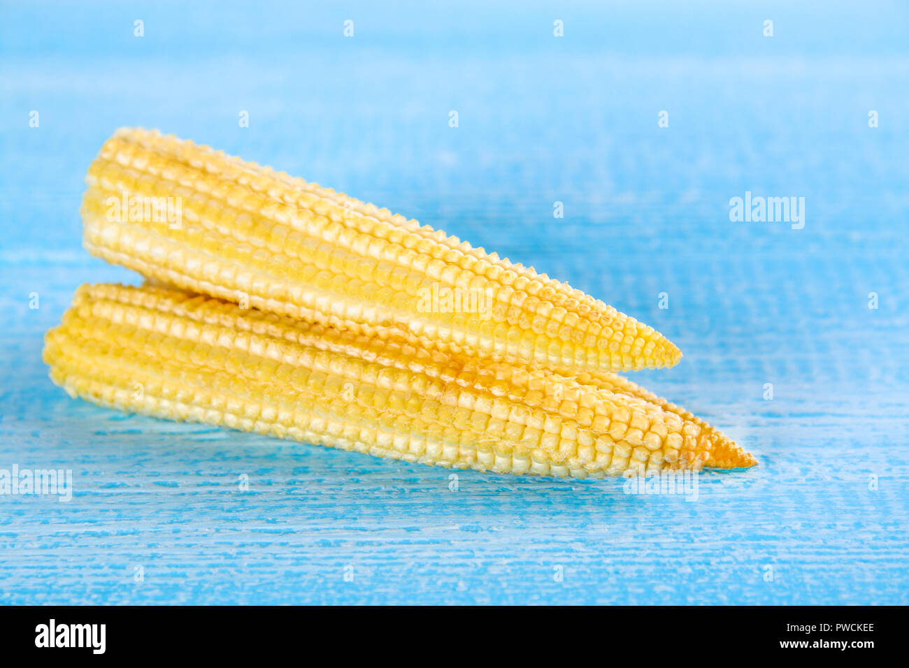 Baby sweetcorn or mini corn. It is typically the eaten whole cob ...