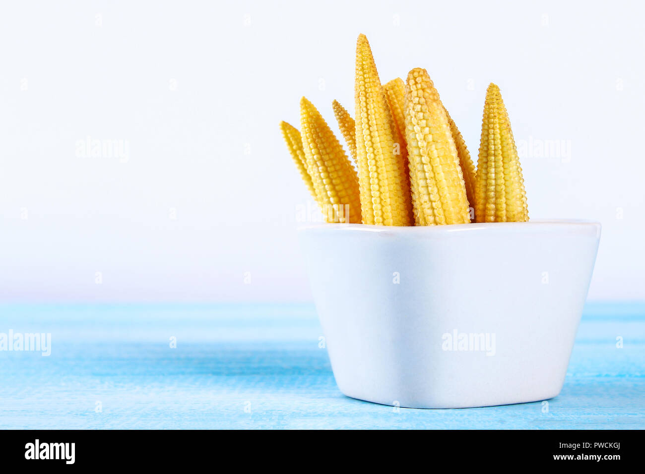 Baby sweetcorn or mini corn. It is typically the eaten whole cob ...