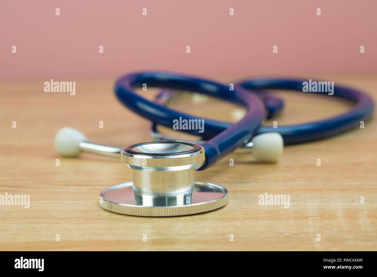 Stethoscope with blue tube on table, health and medical concept idea ...