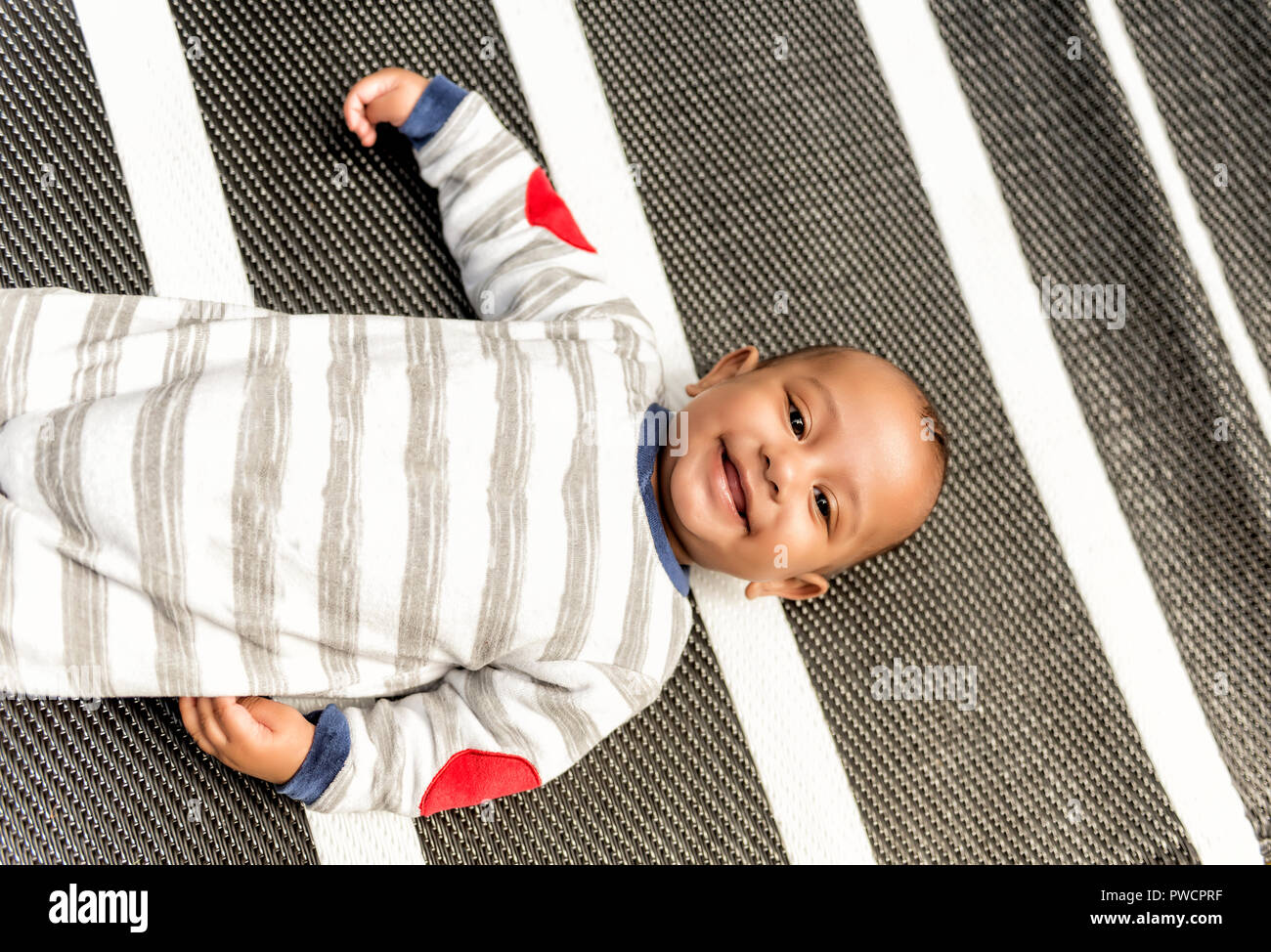 A baby playing outside Stock Photo - Alamy