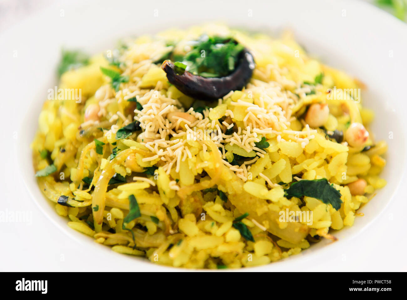 Indian traditional breakfast Poha Stock Photo - Alamy