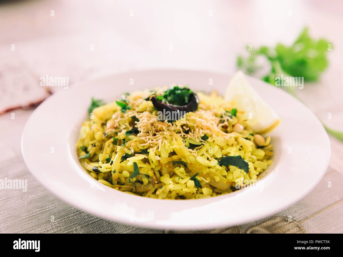 Indian traditional breakfast Poha Stock Photo - Alamy