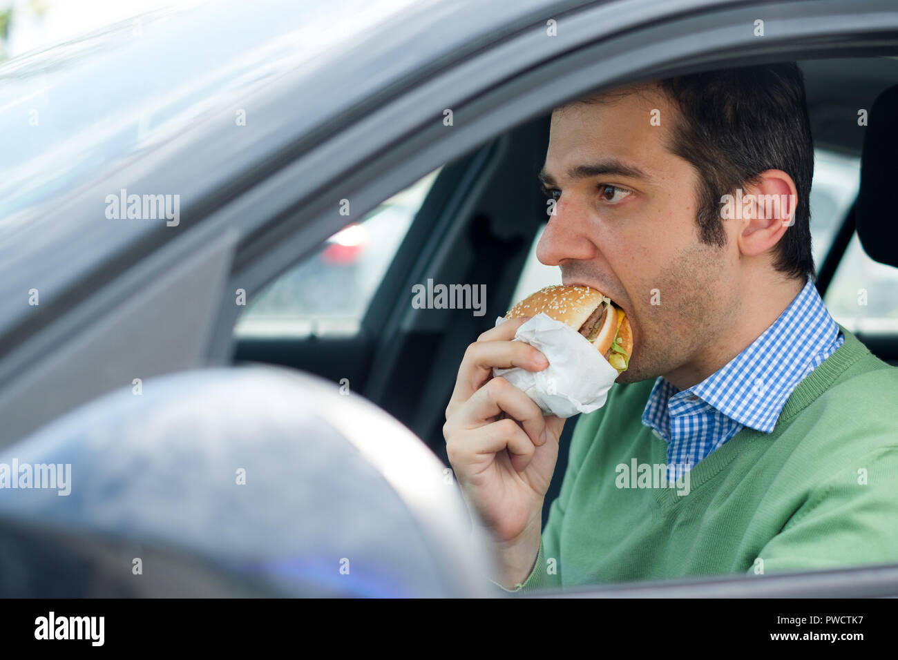 Man eating hamburger fries hi-res stock photography and images - Alamy