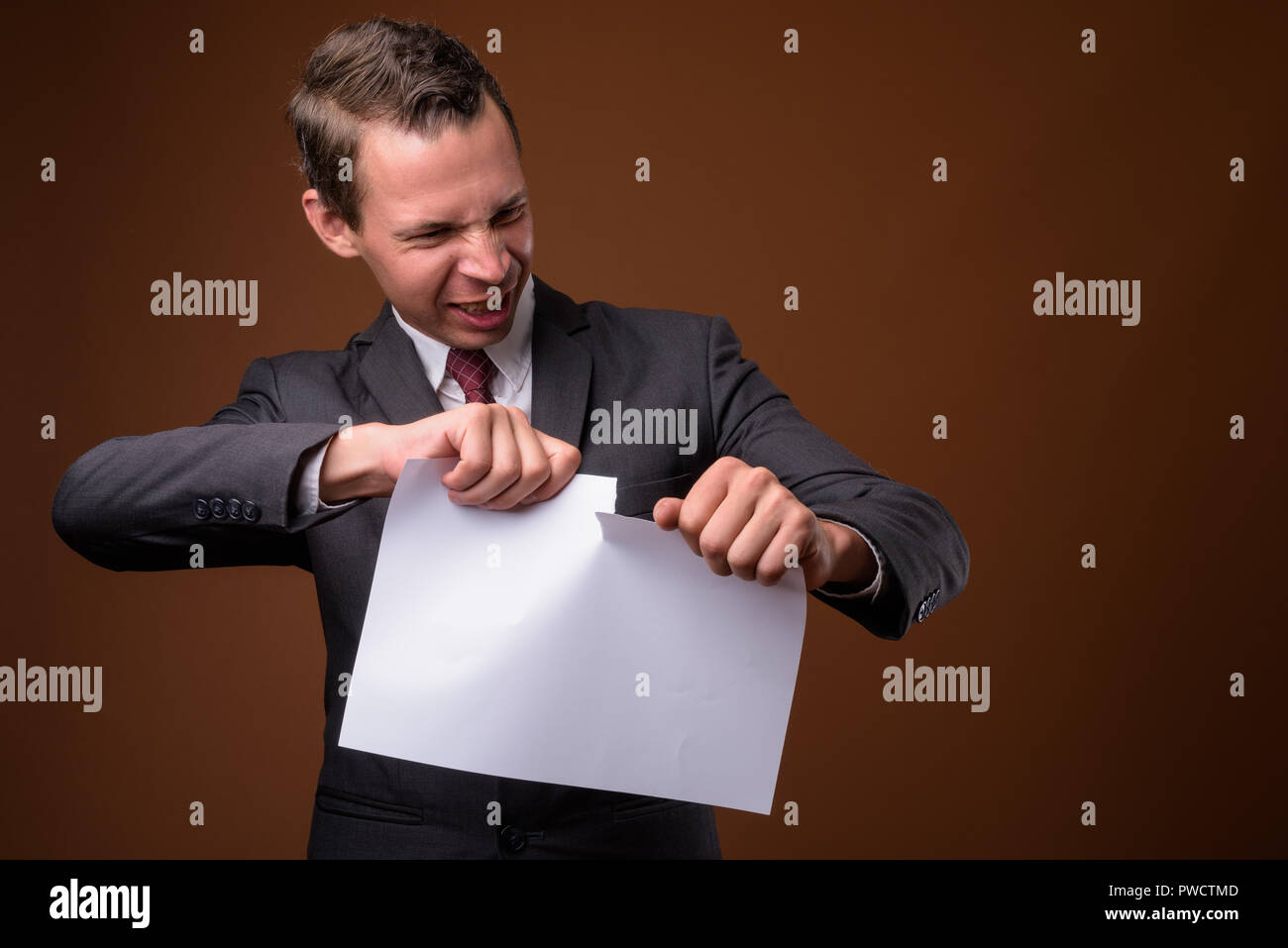 Man ripping paper hi-res stock photography and images - Alamy