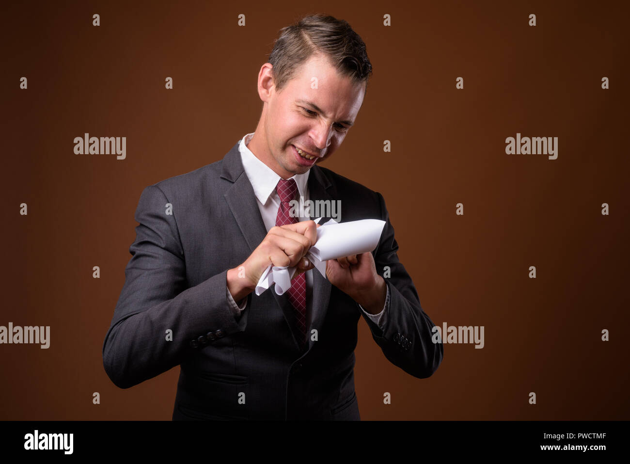 Man ripping paper hi-res stock photography and images - Alamy