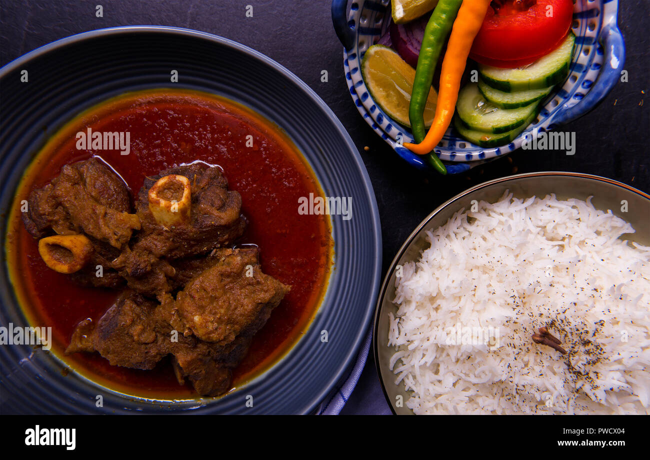 Indian goat meat curry with rice Stock Photo - Alamy