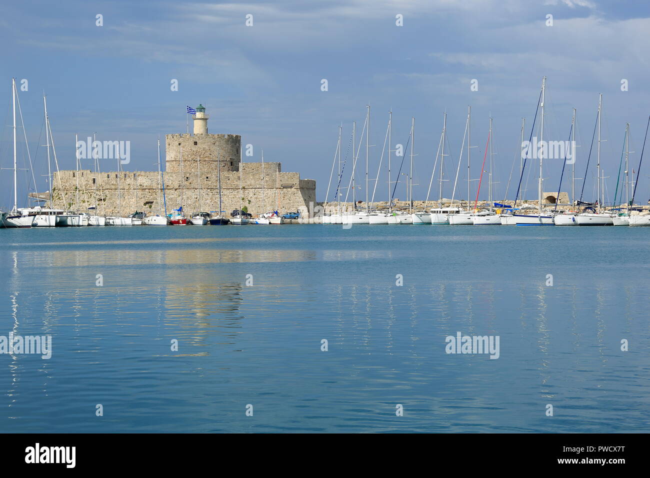 Views of the Mandraki harbor from the island of Rhodes, where the ...