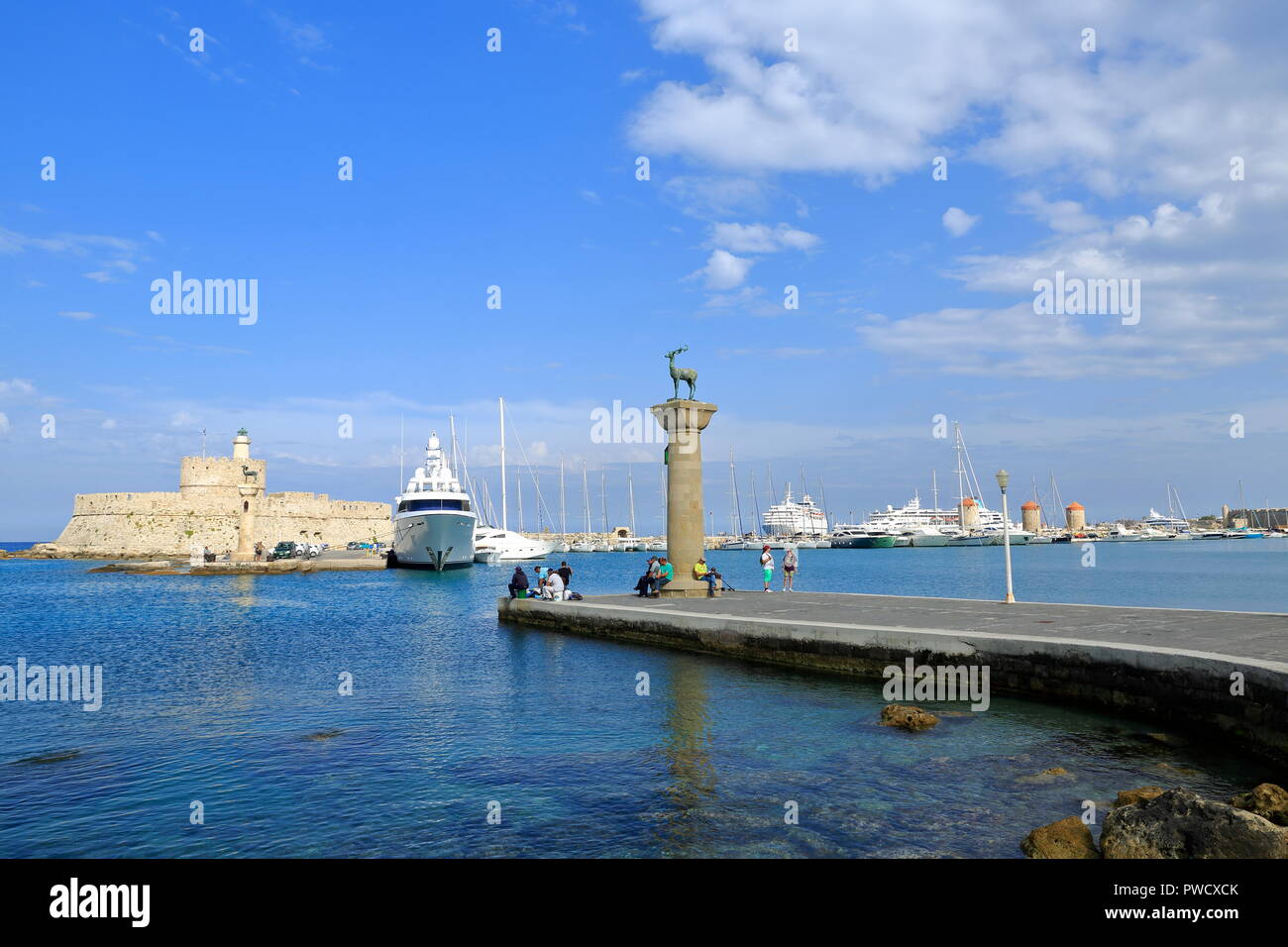 Views of the Mandraki harbor from the island of Rhodes, where the ...