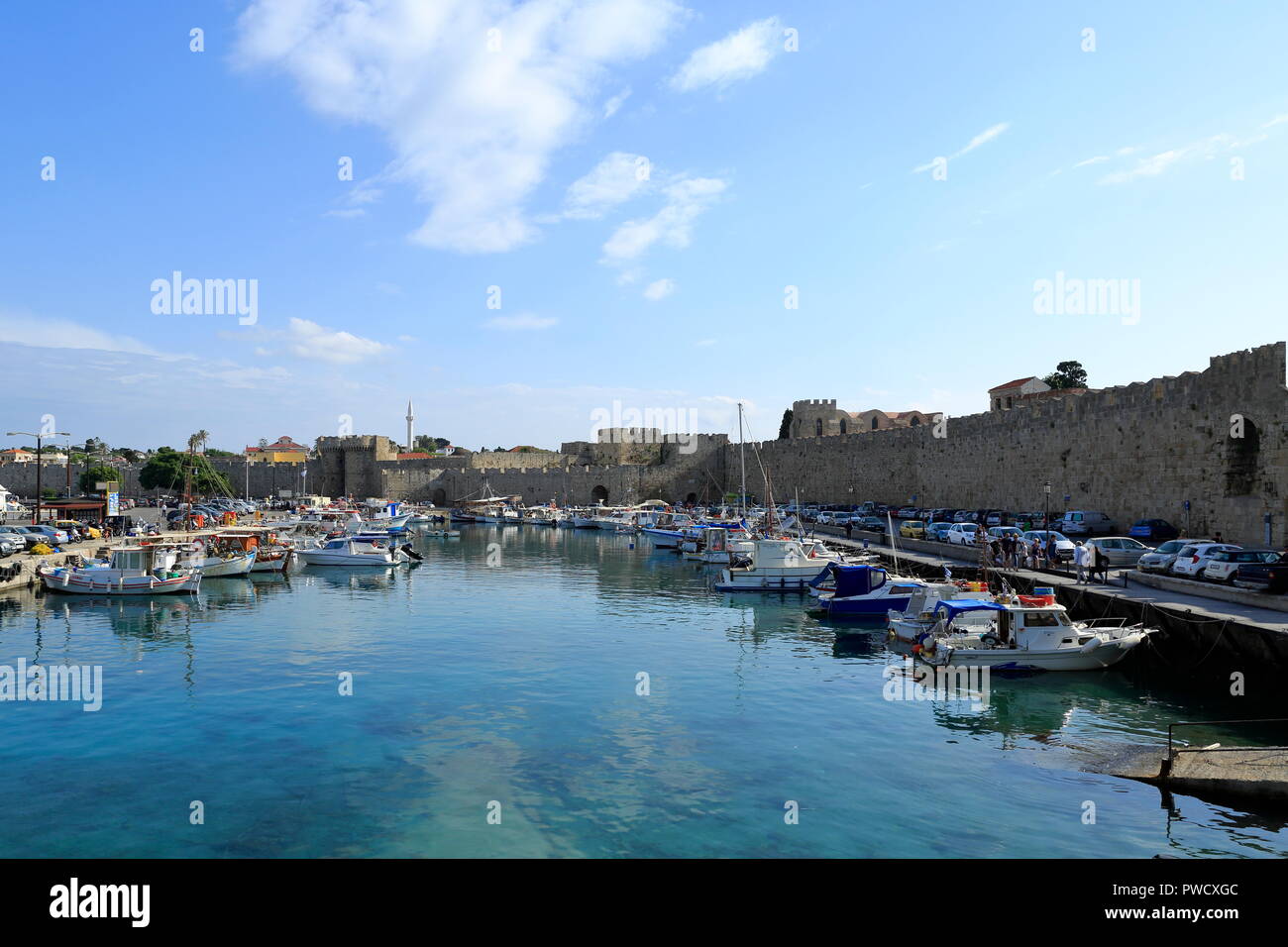 Views of the Mandraki harbor from the island of Rhodes, where the ...