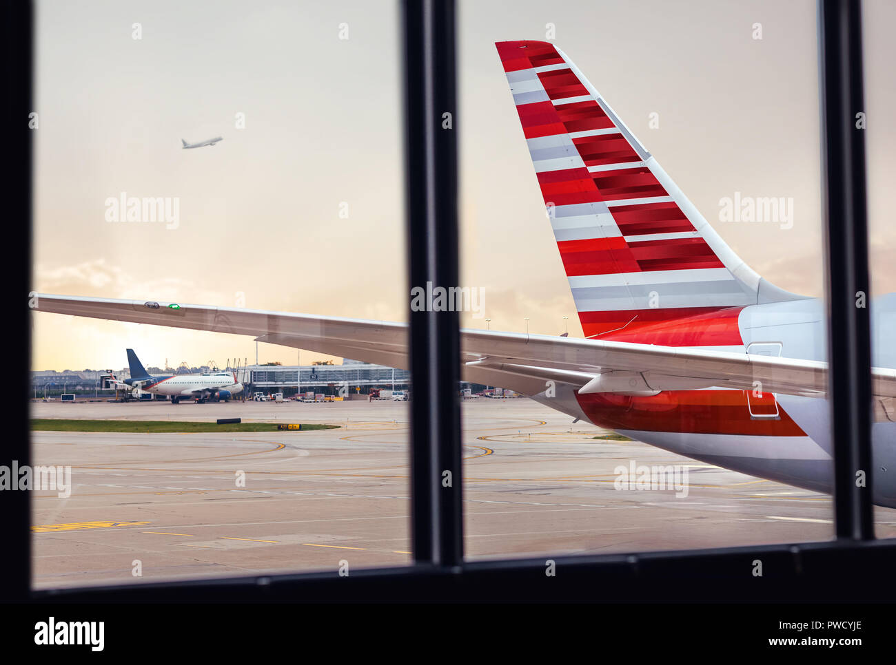 View of airplane fuselage tail through window at airport Stock Photo ...