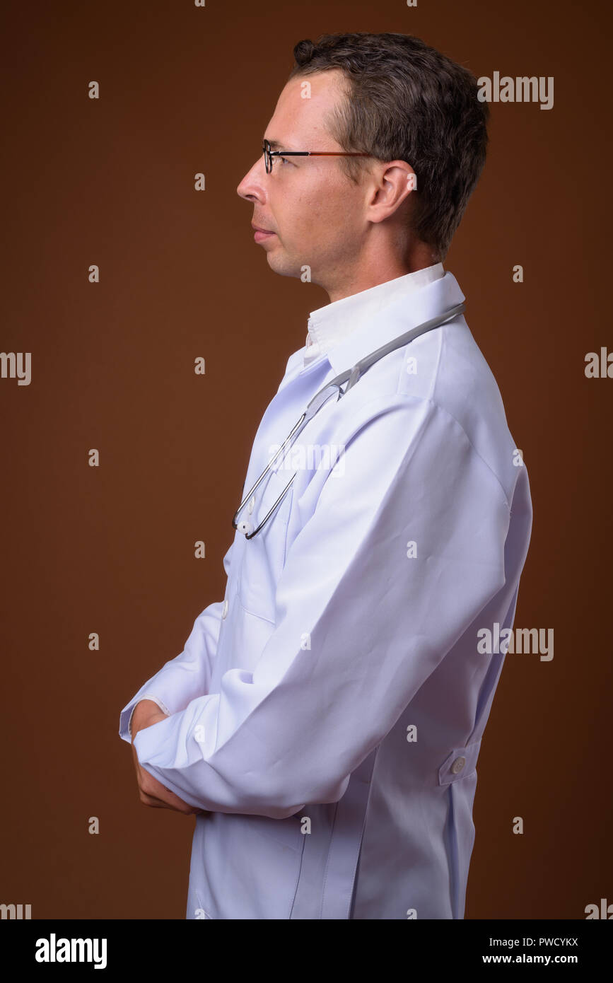 Side view confident male doctor hi-res stock photography and images - Alamy