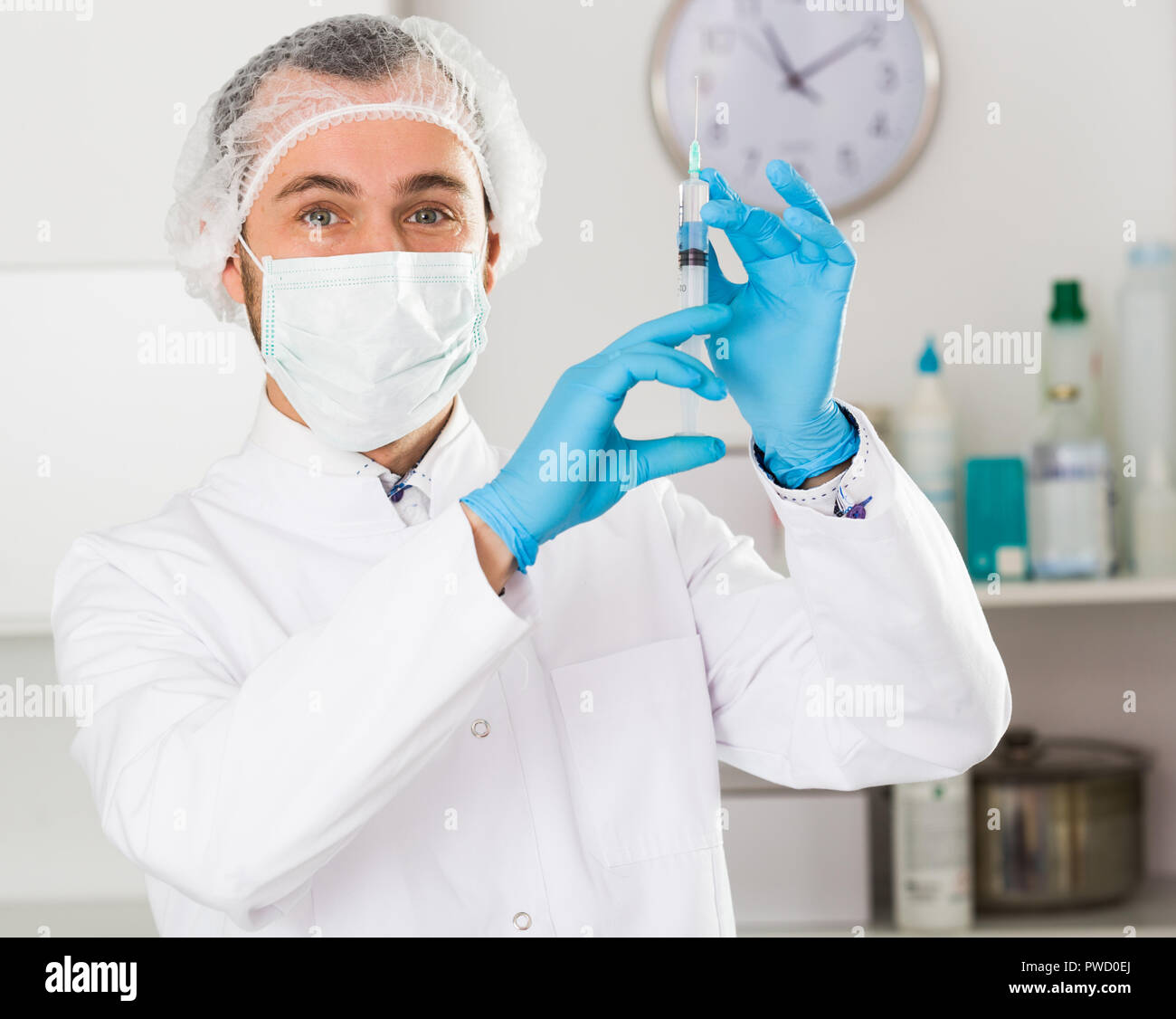 Young male nurse ready to make injection in hospital Stock Photo - Alamy