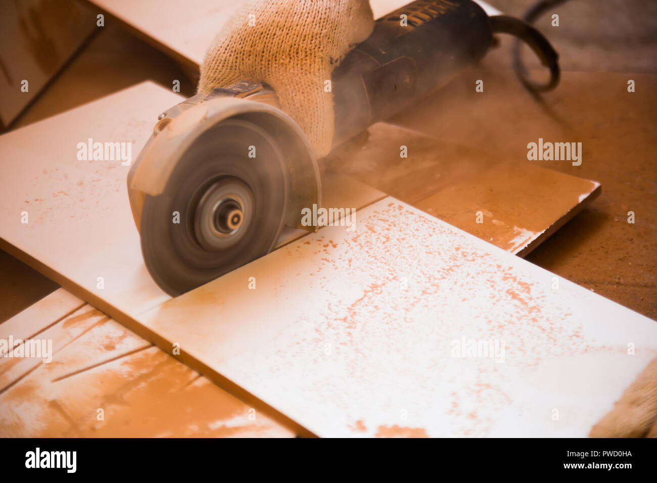 side grinder working on paving tile on building site Stock Photo - Alamy
