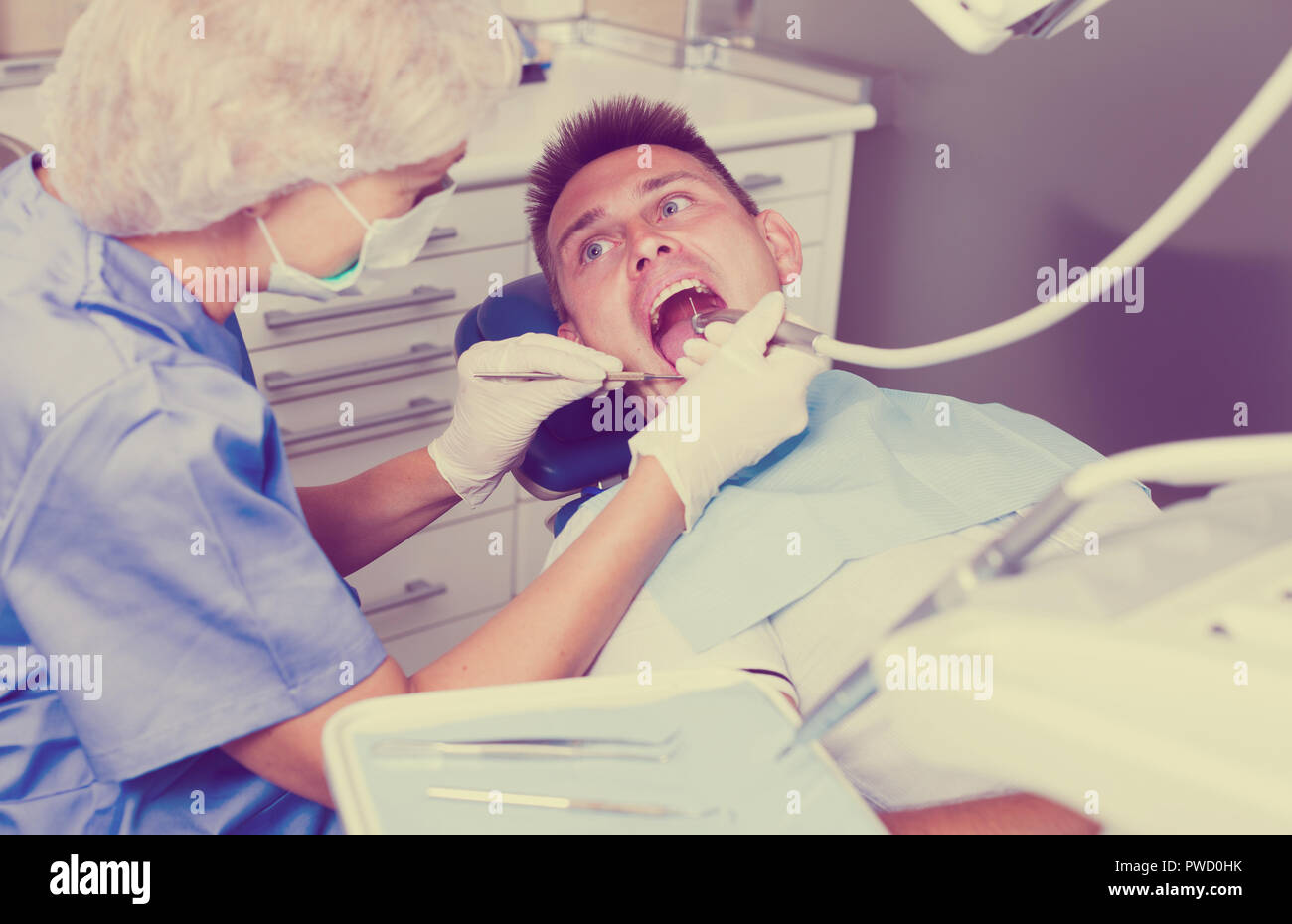 Young man visiting dentist, taking care of his health and dental ...