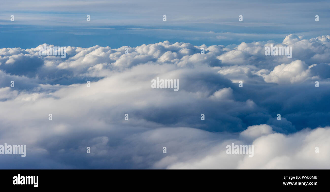 View of clouds from airplane window, clouds in a blue sky Stock Photo ...