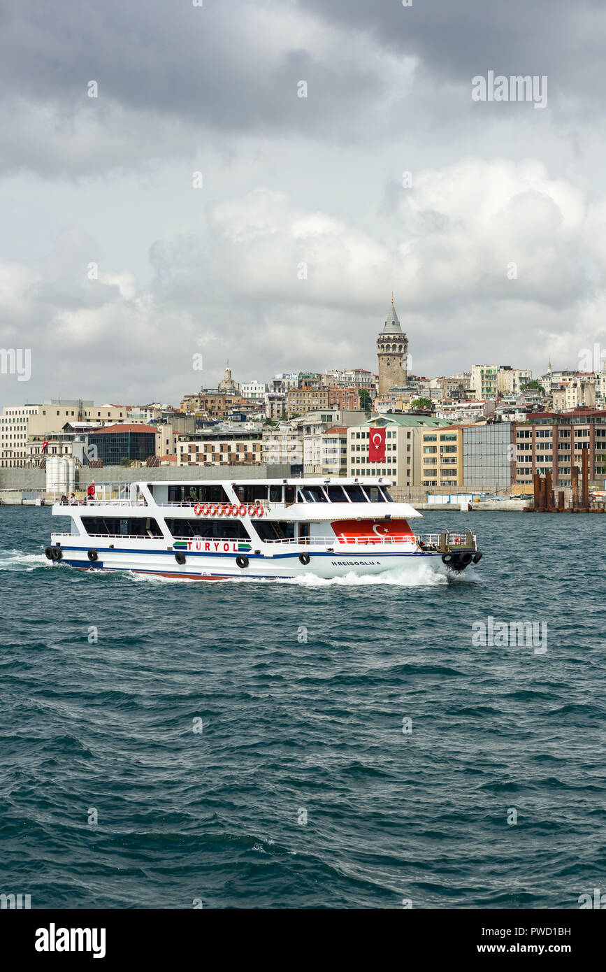 A Turyol passenger ferry with a large Turkish flag on it sails past ...