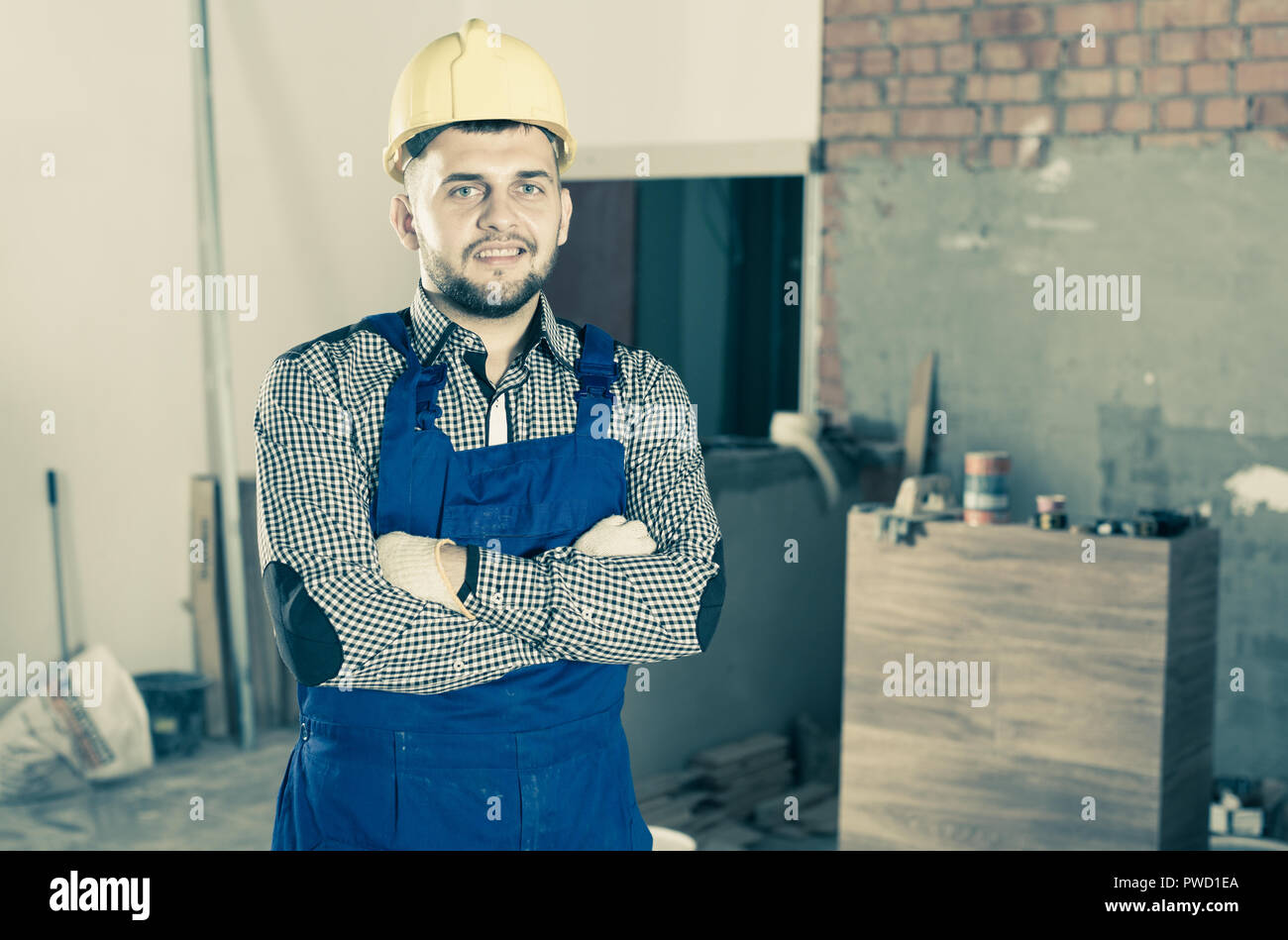 Portrait of workman which is doing repair at home Stock Photo - Alamy