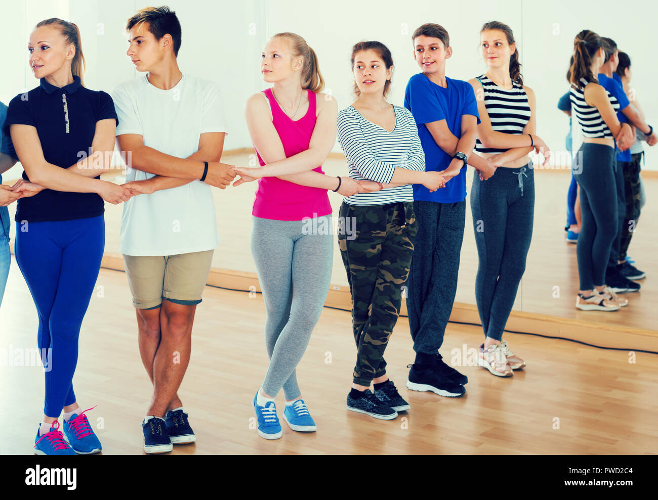 positive teens studying folk style dance in class Stock Photo - Alamy