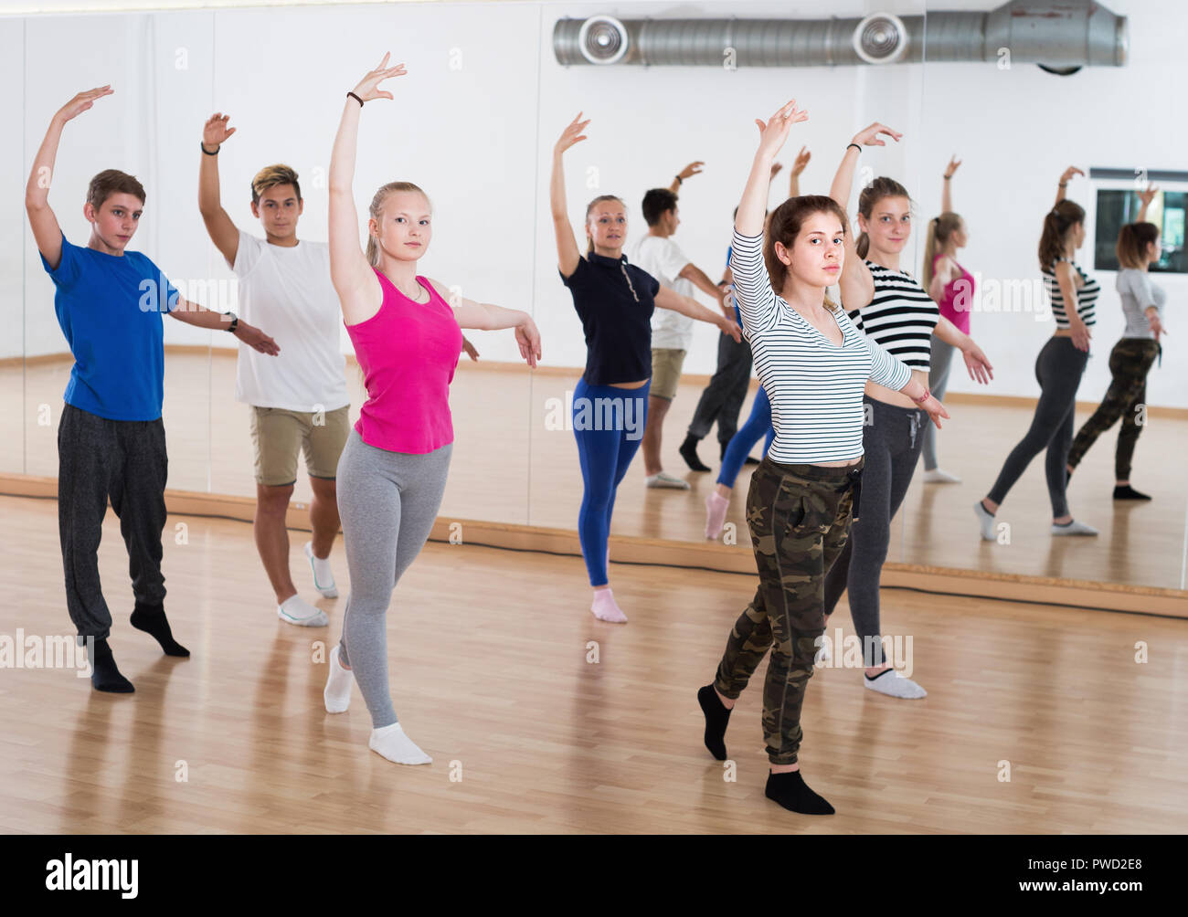 Woman dance teacher with students at dance studio Stock Photo - Alamy