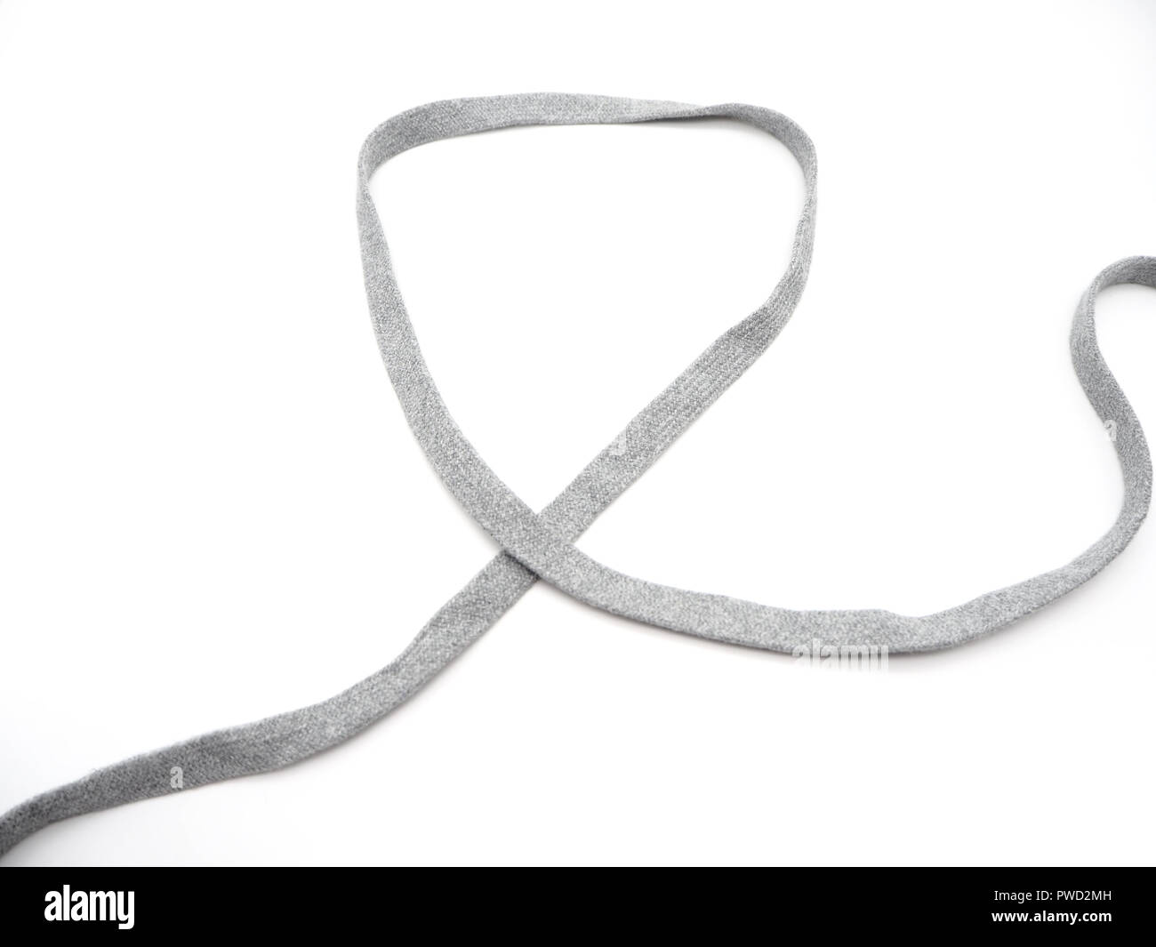 A grey fabric rope isolated on a white background Stock Photo - Alamy