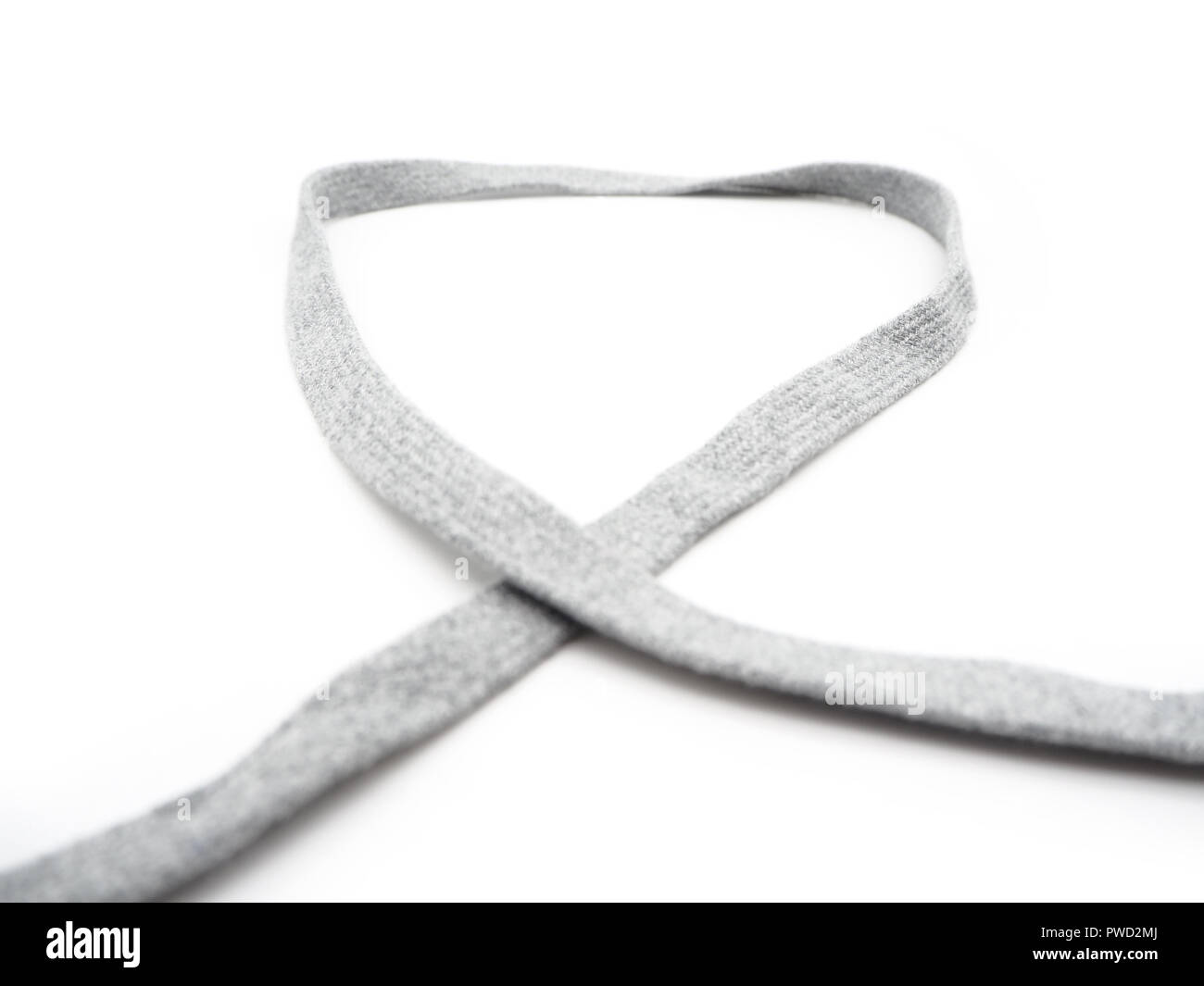 A grey fabric rope isolated on a white background Stock Photo - Alamy