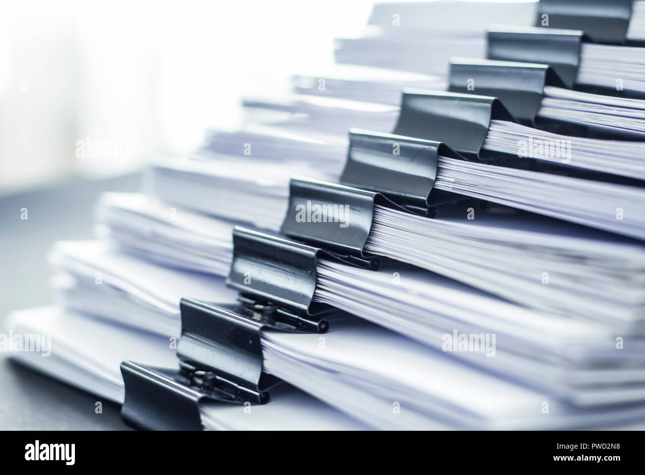 Stacks documents files with black clip Stock Photo - Alamy