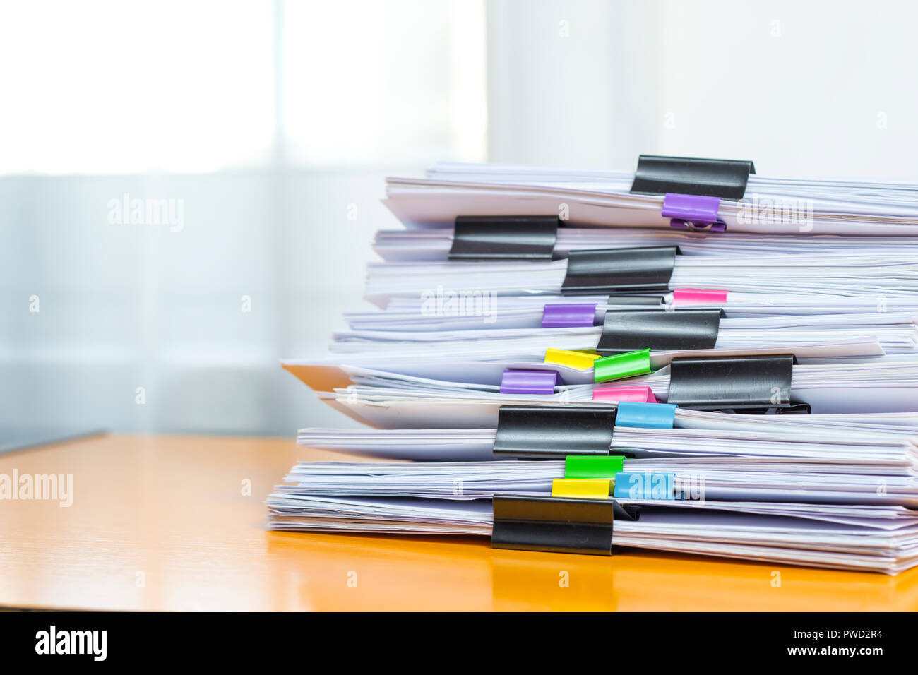 Stacks documents files with black clip Stock Photo - Alamy