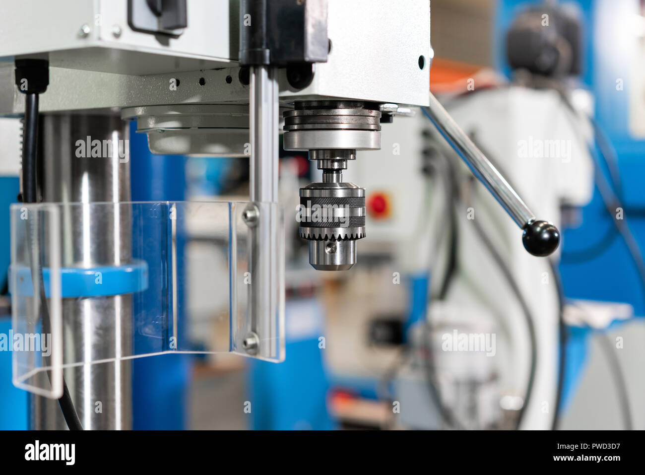 New Industrial Iron drill in workshop interior. Closeup on the drill ...