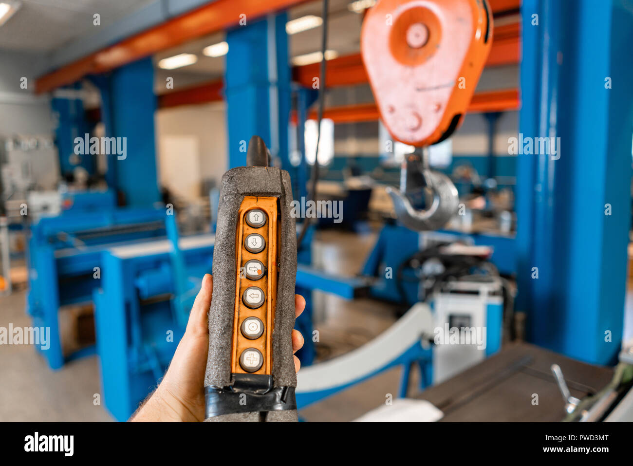 remote control of the crane on production. Workers working with a crane ...